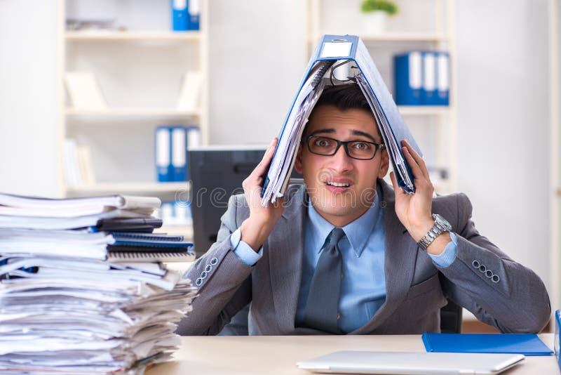 The Overloaded with Work Employee Under Paperwork Burden Stock Photo ...