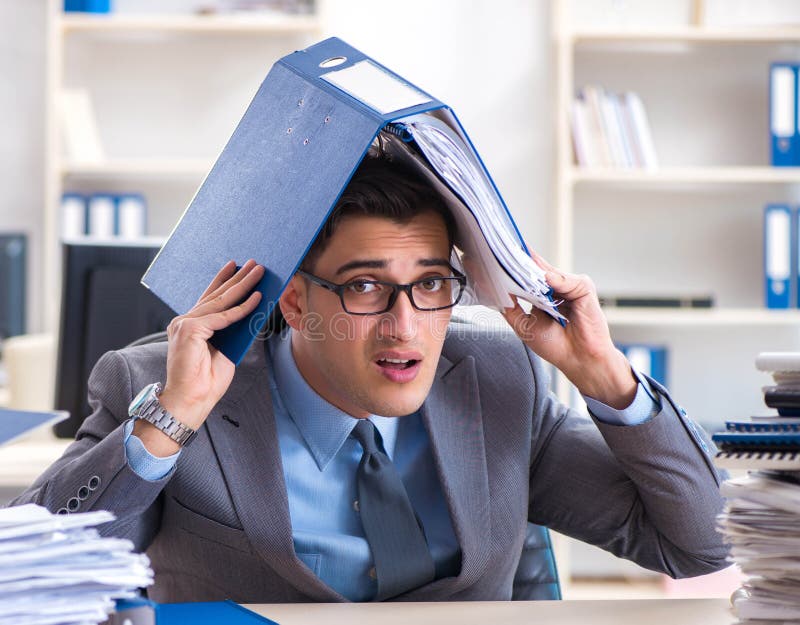 The Overloaded with Work Employee Under Paperwork Burden Stock Photo ...
