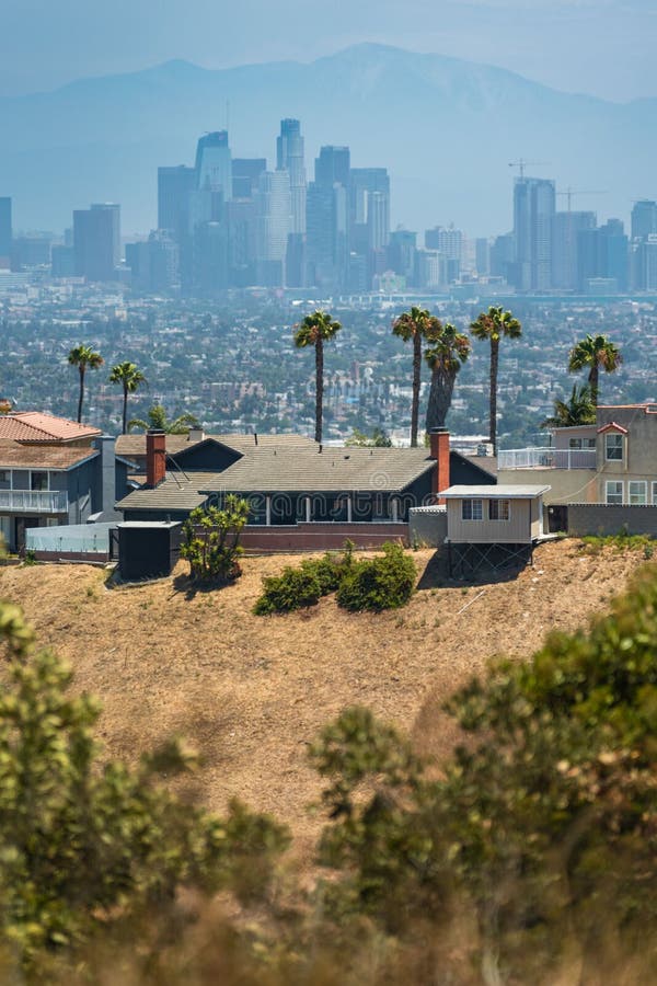 Overlooking Home at the Top of a Hill with Los Angeles Skyline in the ...
