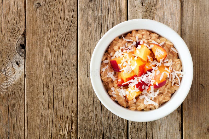 Overnight Breakfast Oats with Peach and Coconut on Rustic Wood Stock ...