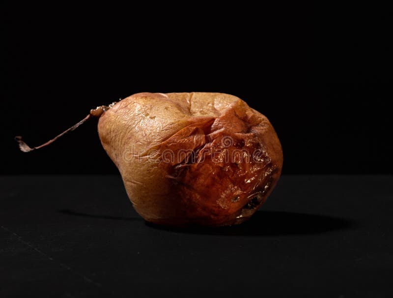 Overripe Pear with Black Background and Warm Lighting. Stock Photo ...