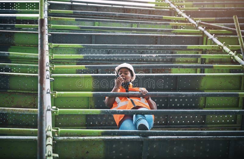 Overseeing it All As the Project Manager. a Young Woman Using a Walkie ...