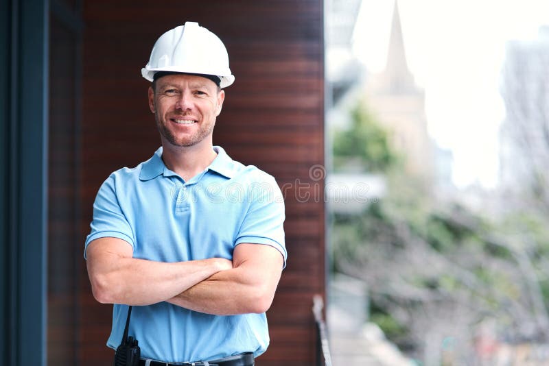 Overseeing the Building Process. Portrait of a Cheerful Engineer Posing ...