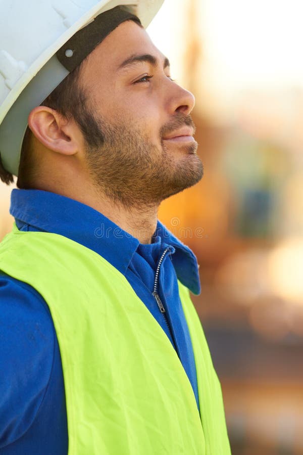 Overseeing the Construction. a Handsome Engineer Looking Away ...