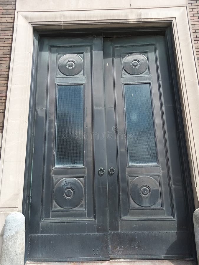 Oversized Black Iron Doors on a Building Entrance Stock Image - Image of iron, house: 277135397