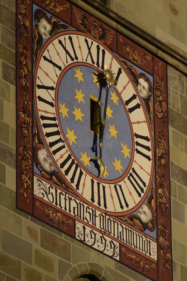 A Very Large Clock Mounted To the Side of a Building Stock Image ...