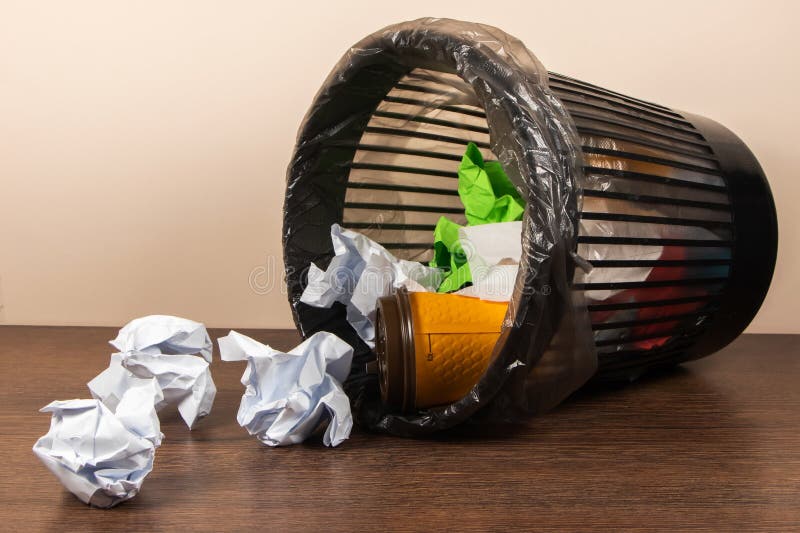 Overturned Trash Can with Crumpled Paper Balls and Disposable Cups ...