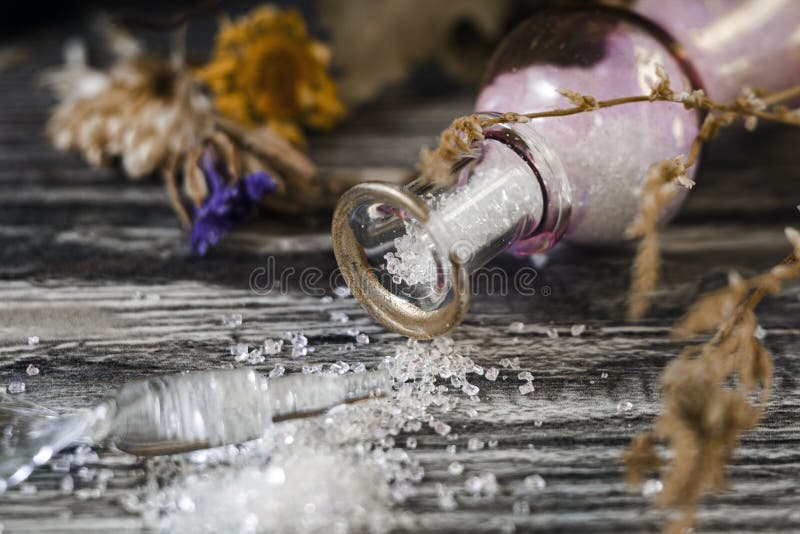 An Overturned Vial of Magic Powder and Dried Herbs Stock Image - Image ...