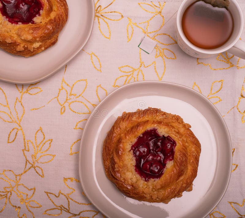 Overview of Two Cherry Danish S with a Cup of Tea Stock Photo - Image ...