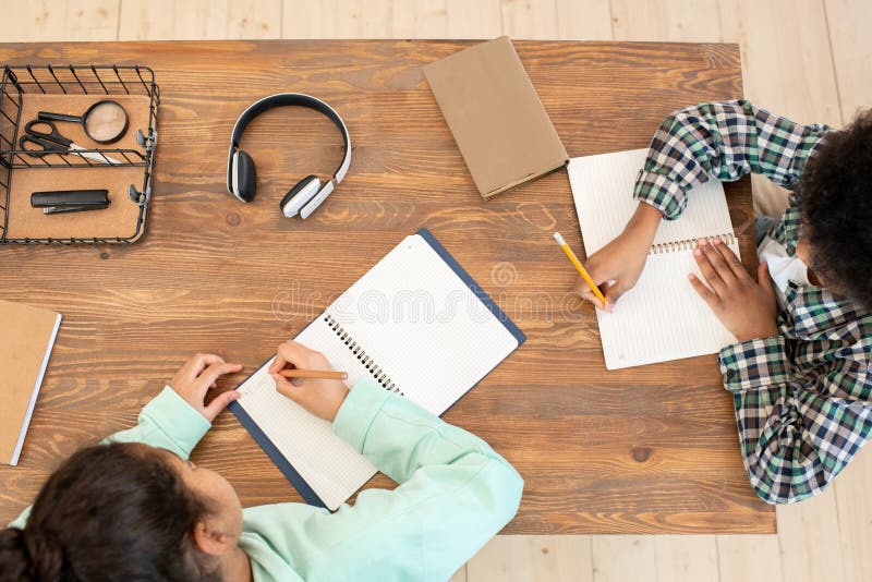 Overview of Two Clever Schoolchildren in Casualwear Making Notes in ... Overview of Two Clever Schoolchildren in Casualwear Making Notes in ...