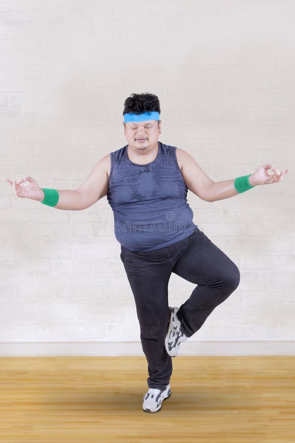 Overweight Guy Doing Exercise at Home Stock Image - Image of meditating ...