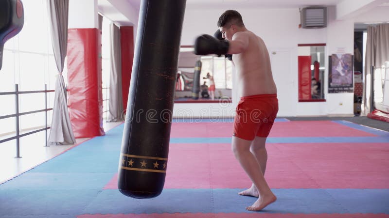 Overweight Kickboxer with the Heavy Bag Stock Video - Video of gloves ...