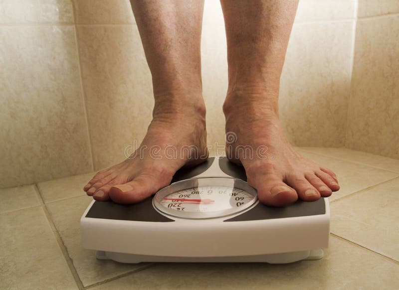 Overweight person on scale stock photo. Image of diet - 5867300