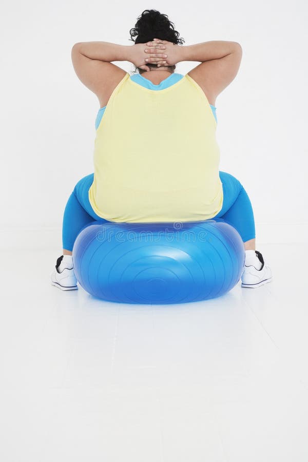 Overweight Woman Sitting on Exercise Ball Stock Photo - Image of ...