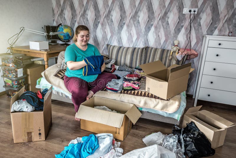 Overweight Woman Sorting Clothes from Wardrobe, Spring Cleaning ...