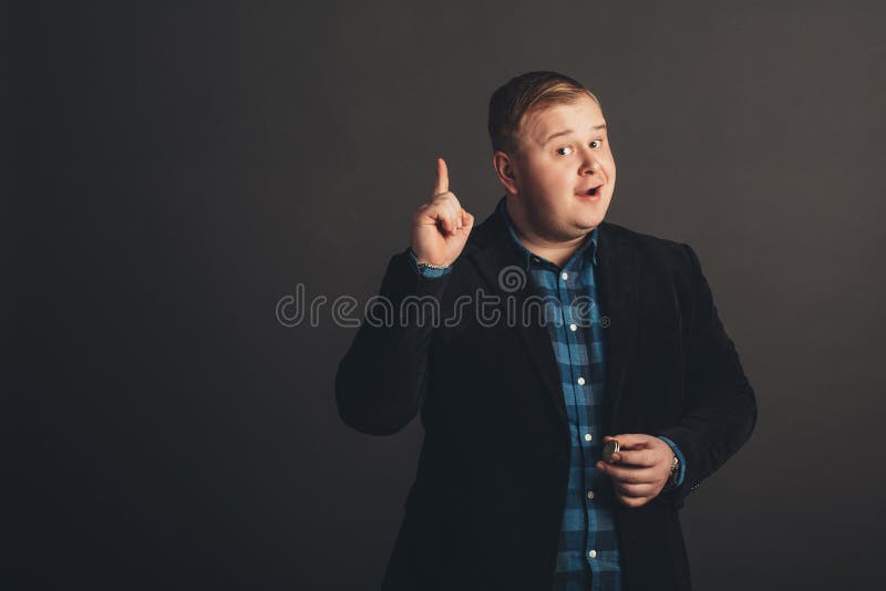 Overweight Young Man Pointing Up Stock Photo - Image of showing ...