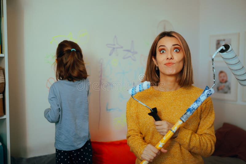 Mom with Rollers Ready To Paint after Child Scribbles on Walls Stock ...