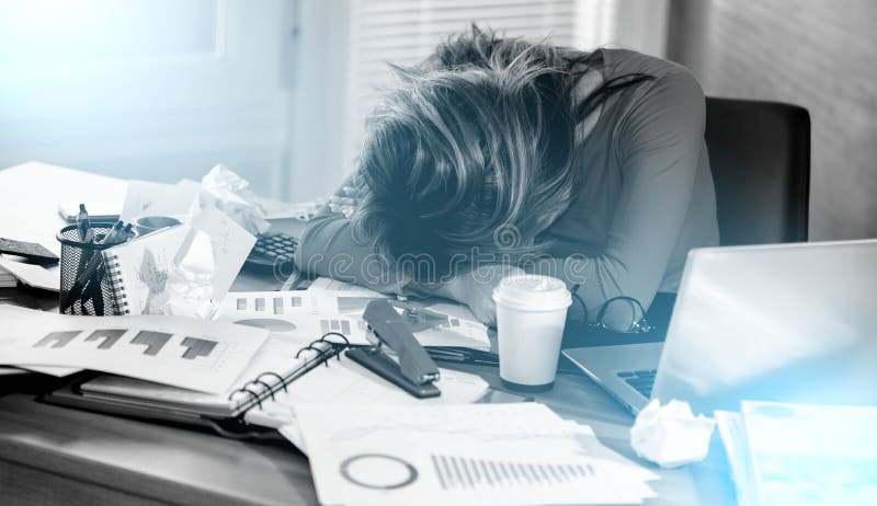Overworked Businesswoman Sitting at a Messy Desk; Light Effect Stock ...