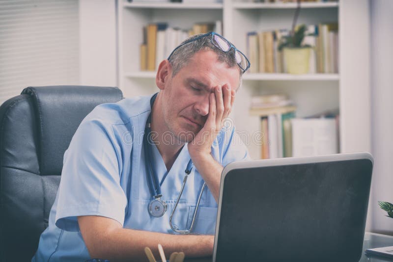 Overworked Doctor in His Office Stock Photo - Image of desk, health ...