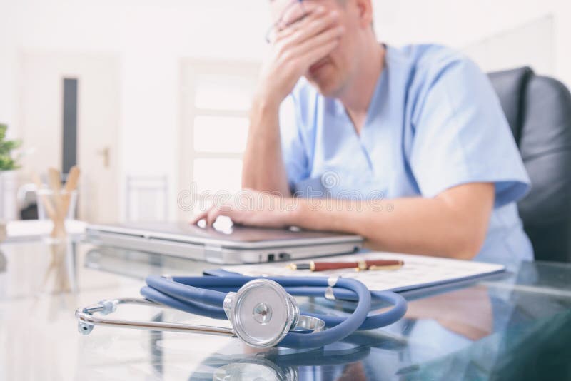 Overworked Doctor in His Office Stock Image - Image of desk, doctor ...