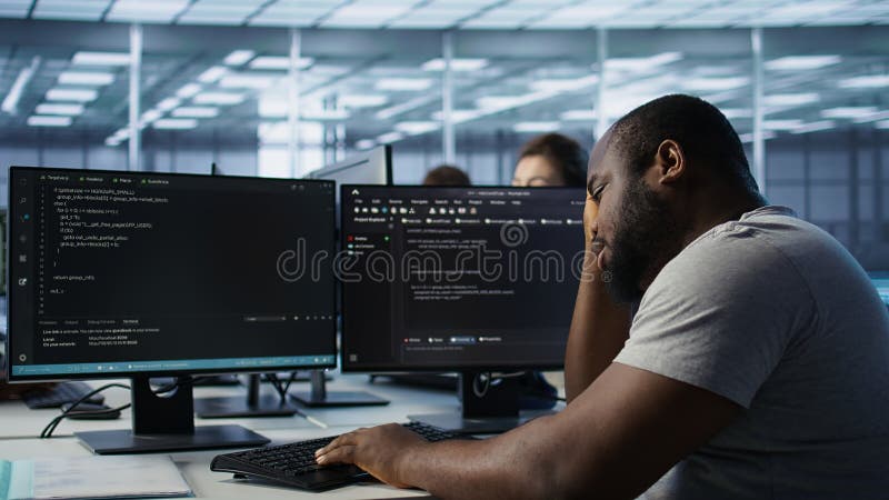 Overworked Engineer Falling Asleep while Typing on Computer in Server Hub Stock Image - Image of ...