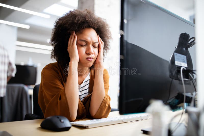 Overworked and Frustrated Young Woman in Front of Computer in Office ...