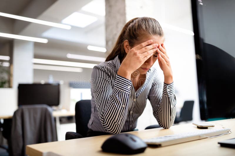 Overworked and Frustrated Young Woman in Front of Computer in Office ...