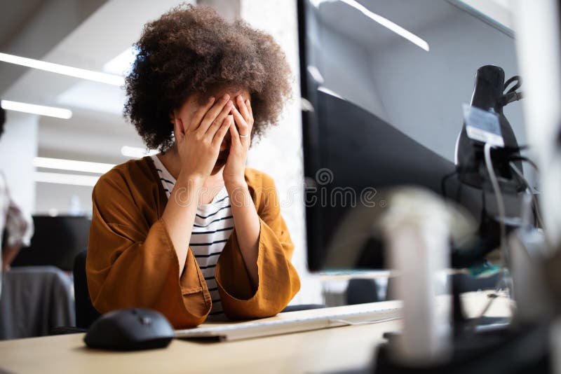 Overworked and Frustrated Young Woman in Front of Computer in Office ...