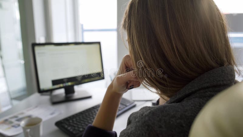 Overworked Lady Sitting in Office, Reading Documentation and Waiting ...