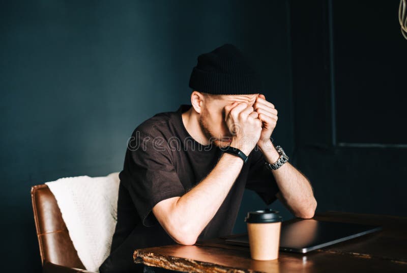 Overworked Man Working on Laptop Computer at Home Office Stock Photo ...