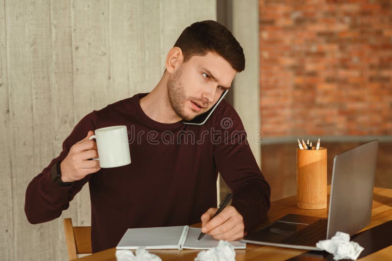 Overworked Office Guy at Laptop Multitasking Working in Office Stock ...