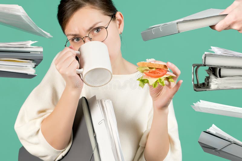 Overworked Office Worker Drinks Coffee and Eats a Sandwich Stock Image ...