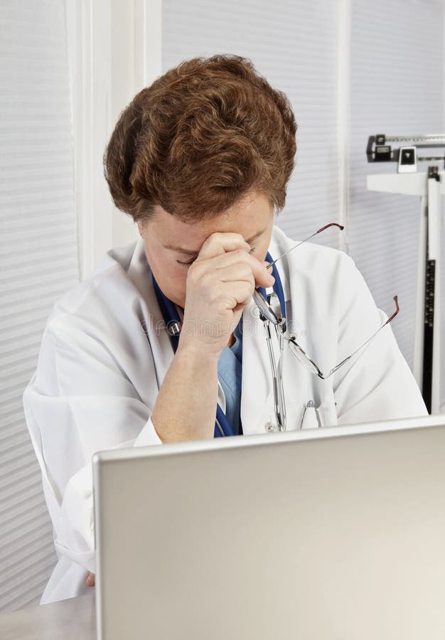 Overworked, Overstressed Female Doctor or Nurse Stock Image - Image of ...