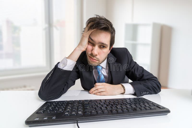 Overworked and Tired Businessman is Working with Computer in Office ...