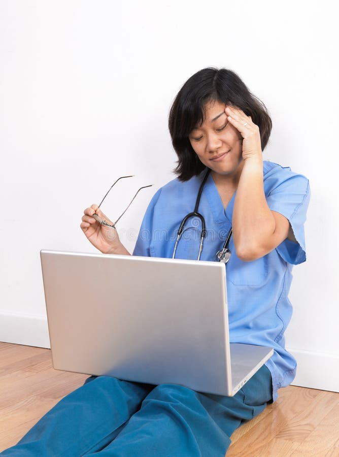 Overworked Woman Doctor or Nurse at Computer Stock Photo - Image of ...