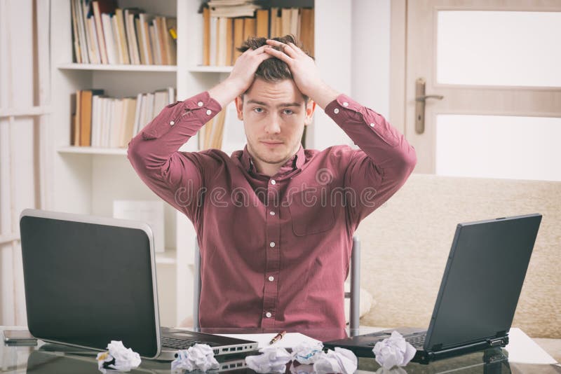 Overworked young man stock photo. Image of business, exhausted - 68061660