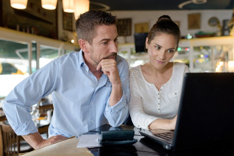 Owner Restaurant Explaining Changes in Online Menu To Waitress Stock ...