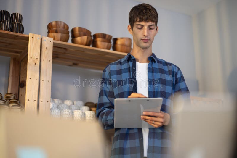 An Owner of Vase Brand Checks Online and Physical Inventory and ... An Owner of Vase Brand Checks Online and Physical Inventory and ...