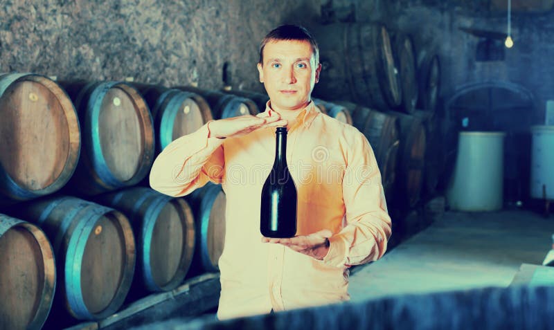 Owner of Winery Showing Bottle of Wine Stock Image - Image of expert ...
