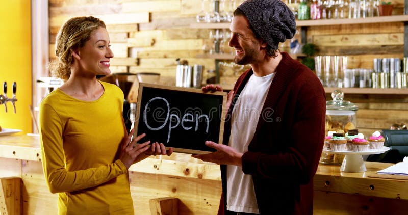 Owners Standing with Open Sign Board in Cafe Stock Video - Video of ...