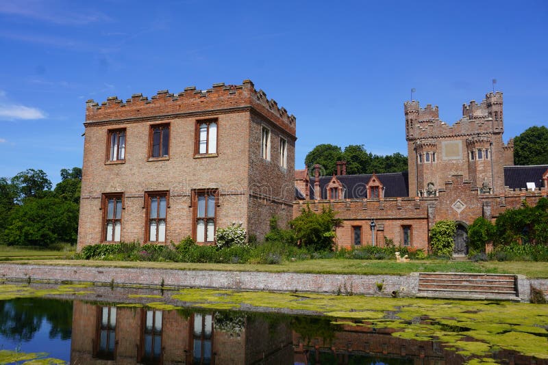 Oxburgh Hall in the sun editorial image. Image of moat - 250623175