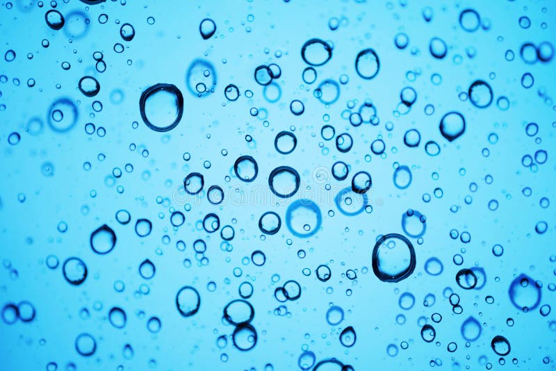 Oxygen Bubbles in Water or Rain Drops on Glass Texture Background. Blue ...