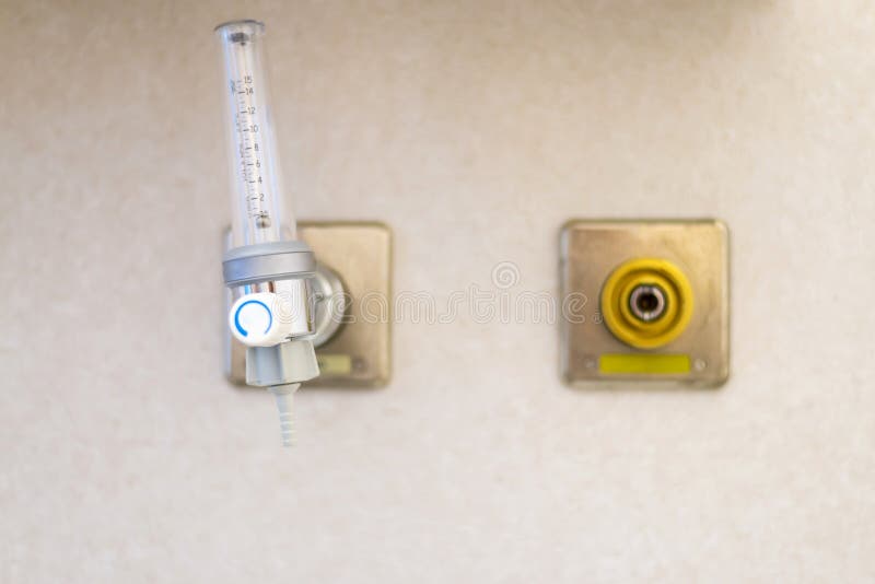 Oxygen Flow Meter Plugged In The Green Outlet On Hospital Wall, Medical ...