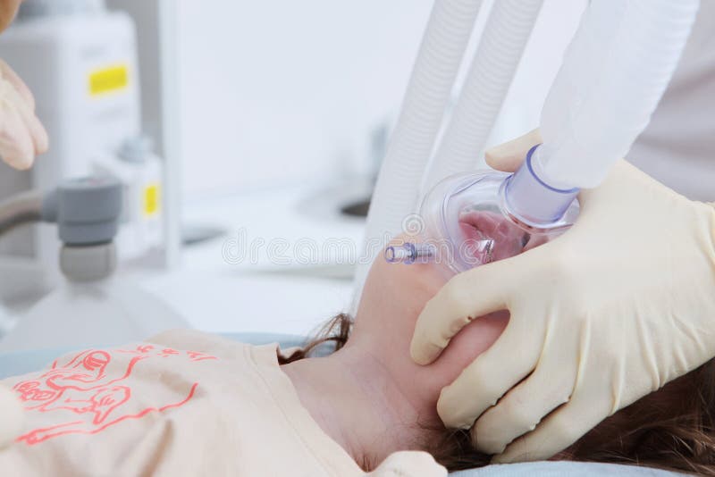 Little Girl before Surgery. the Resuscitator Holds an Oxygen Mask on ...