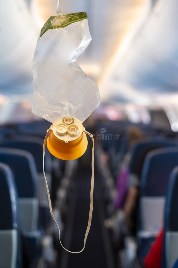 Oxygen Mask Drop from the Ceiling Compartment on Airplane Stock Photo ...