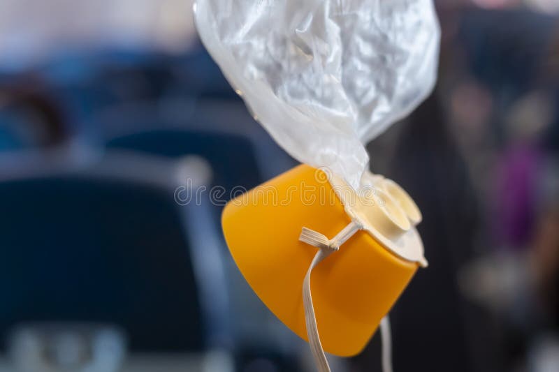 Oxygen Mask Drop from the Ceiling Compartment on Airplane Stock Photo ...
