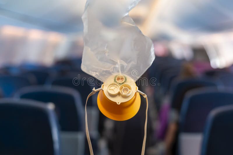 Oxygen Mask Drop from the Ceiling Compartment on Airplane Stock Photo ...