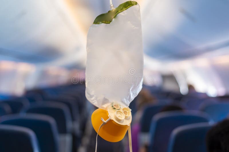 Oxygen Mask Drop from the Ceiling Compartment on Airplane Stock Image ...