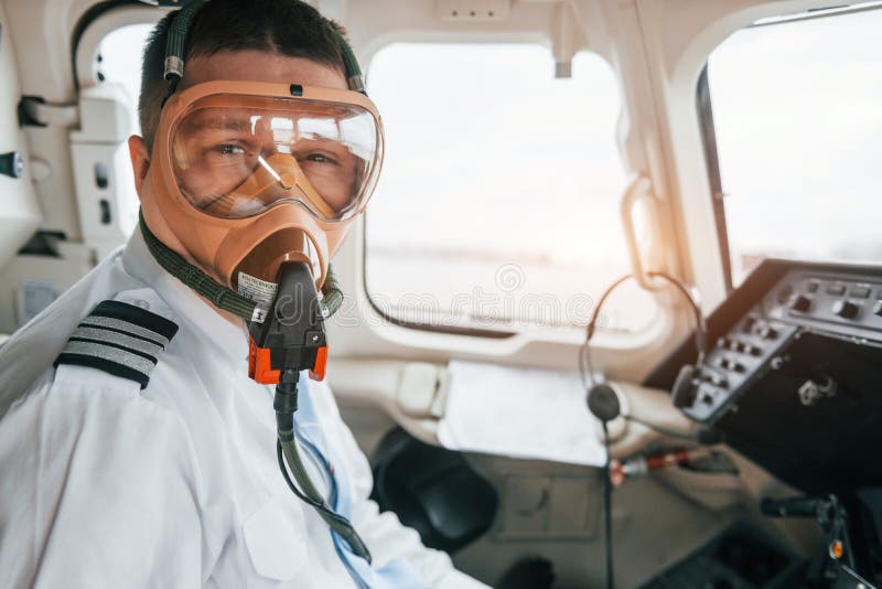 In Oxygen Mask. Pilot on the Work in the Passenger Airplane Stock Image ...