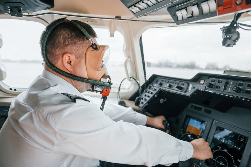 In Oxygen Mask. Pilot on the Work in the Passenger Airplane Stock Image ...
